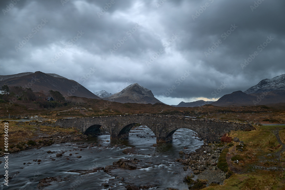 Powerful sky with the old stone bridge, characteristic and famous of ...