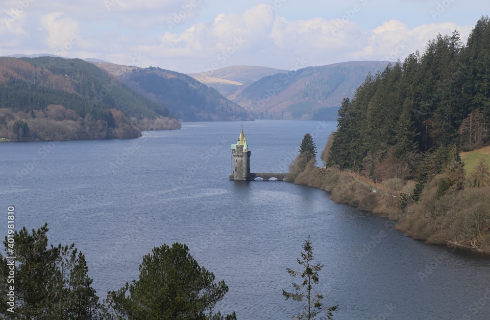 A view across Lake Vyrnwy in Wales showing the Gothic revival straining ...
