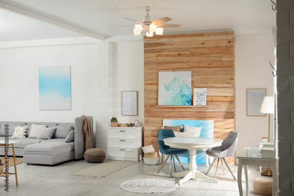 Stylish apartment interior with modern ceiling fan Stock Photo | Adobe ...
