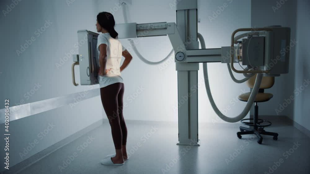 Hospital Radiology Room: Beautiful Multiethnic Woman Standing in the X ...