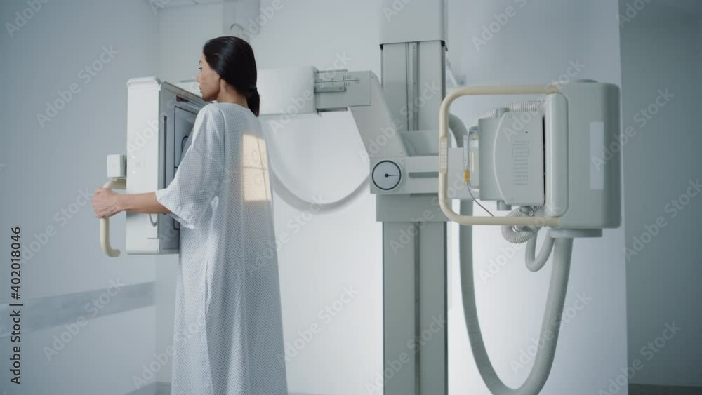 Hospital Radiology Room: Beautiful Multiethnic Woman in Medical Gown ...