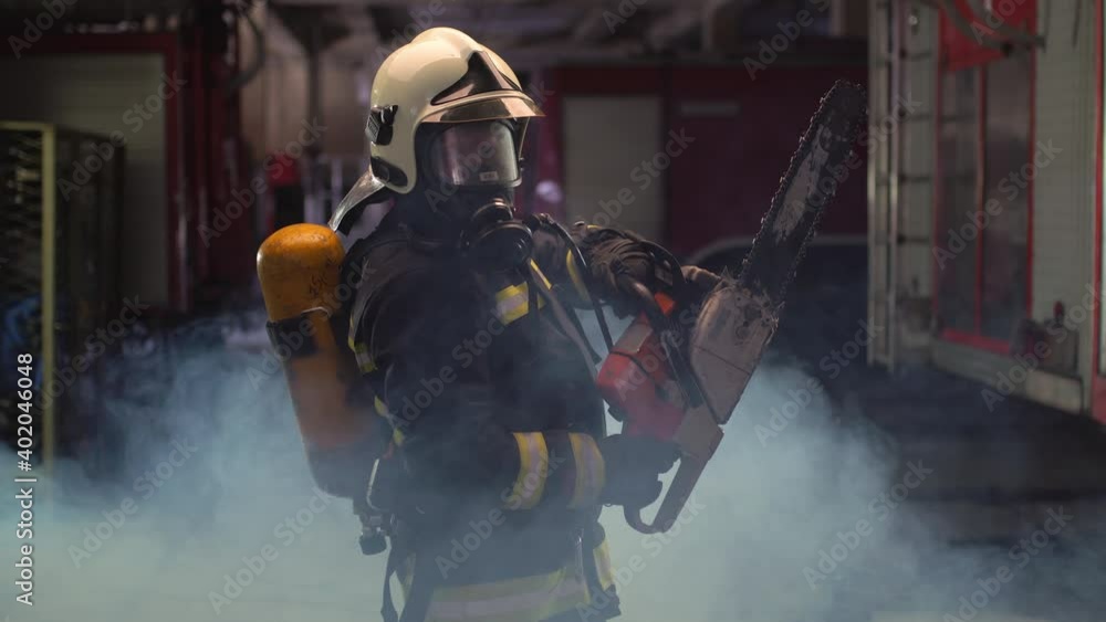 firefighter portrait wearing full equipment, oxygen mask, and power ...