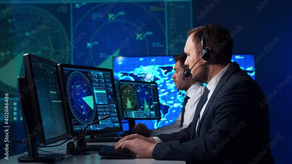 Workplace of the air traffic controllers in the control tower. Team of ...