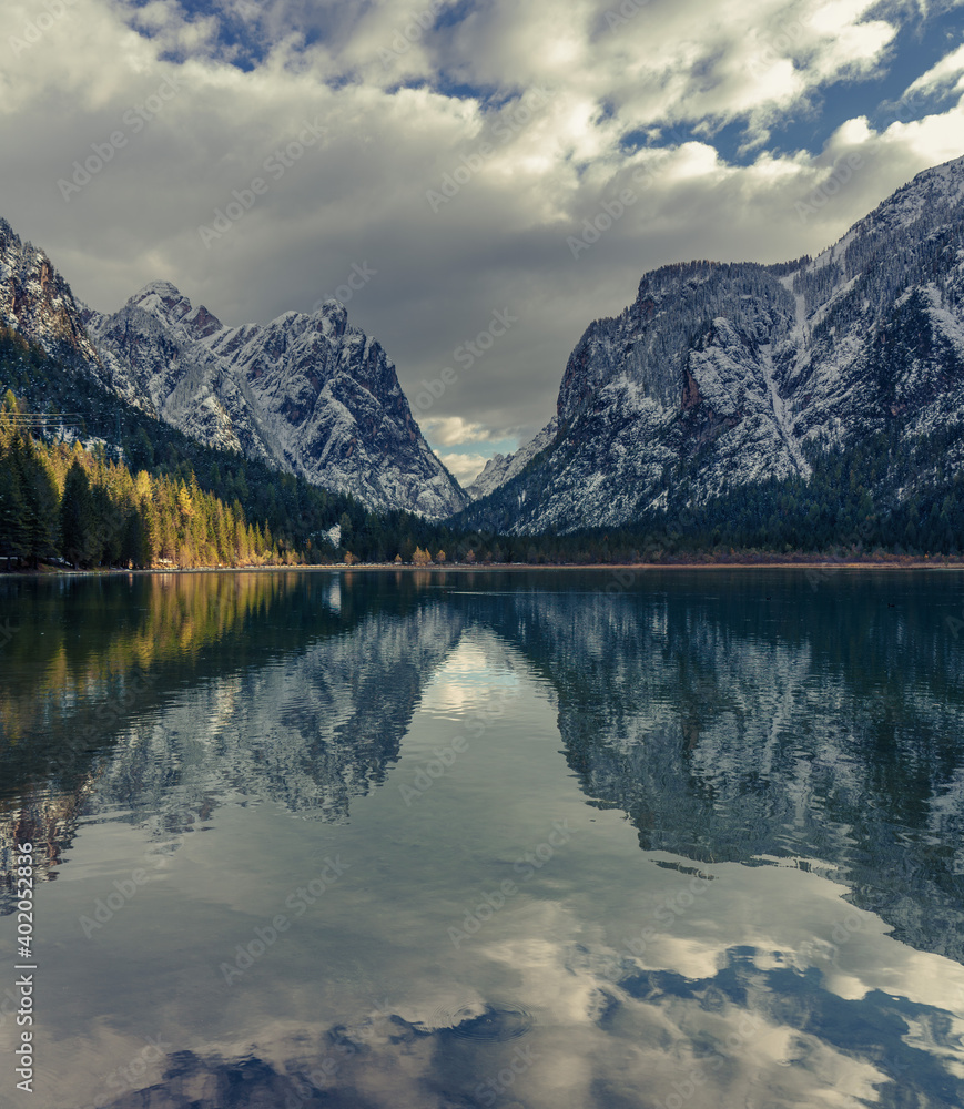 Mountains reflecting in the water of a mountain lake in Italy Stock ...