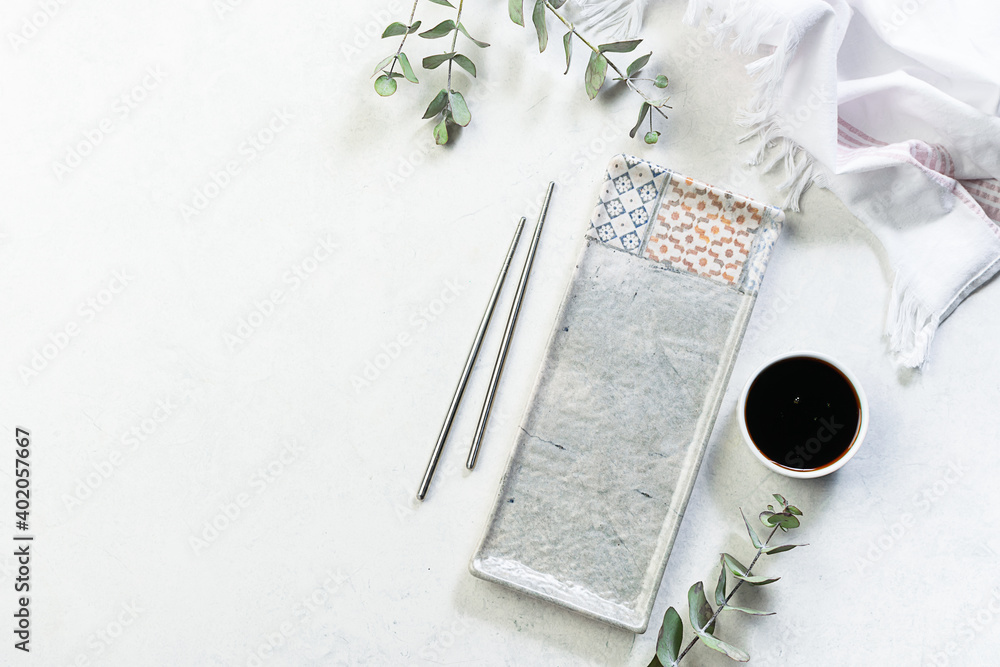 Traditional Asian table setting with sushi chopsticks, long ceramic ...