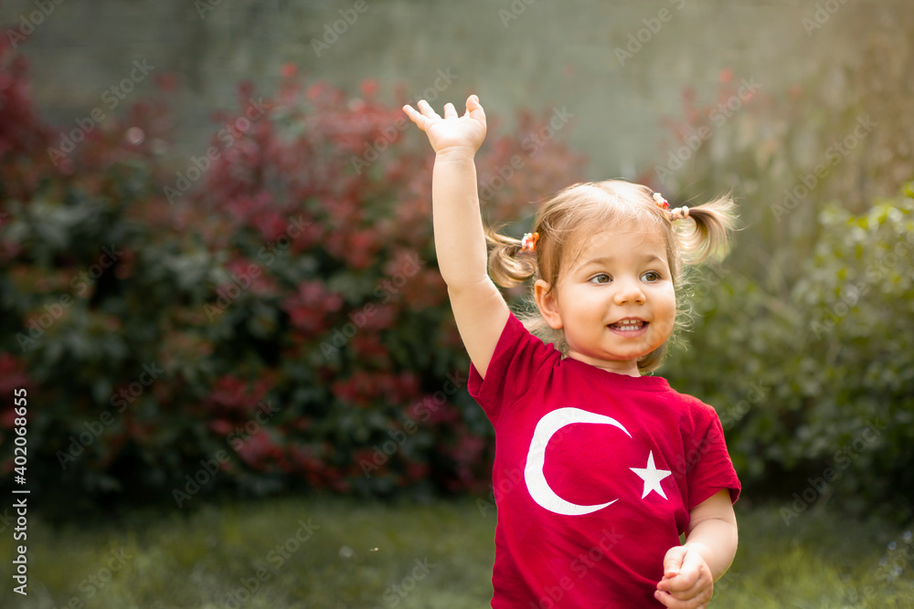Portrait of happy little kid, cute baby toddler with Turkish flag t ...