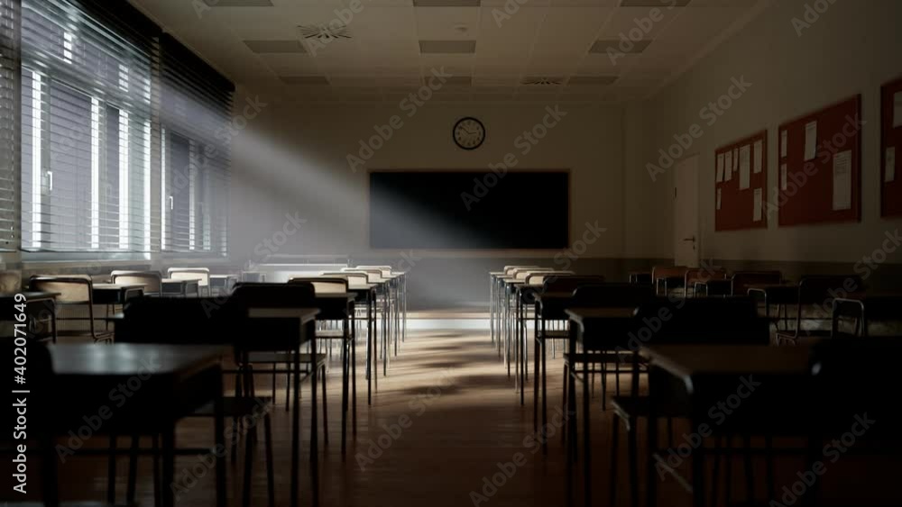 Rays of light falling to the empty classroom. Abandoned school ...