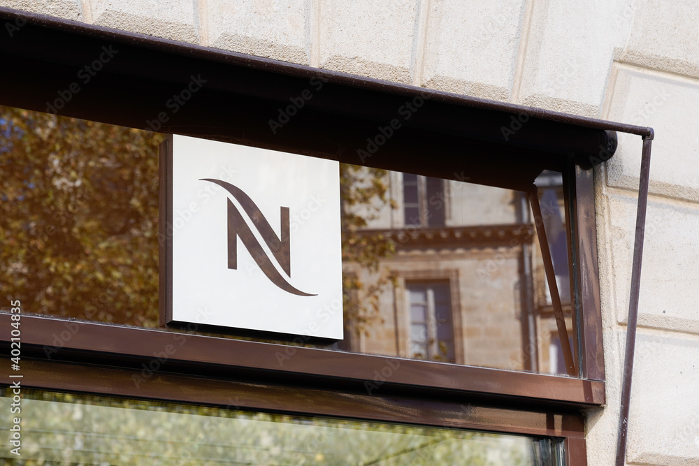 Nespresso logo sign brand of coffee machines front of shop on store ...