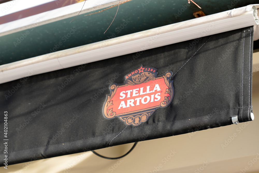 Stella Artois beer of Belgian sign text and brand logo on wall pub bar ...