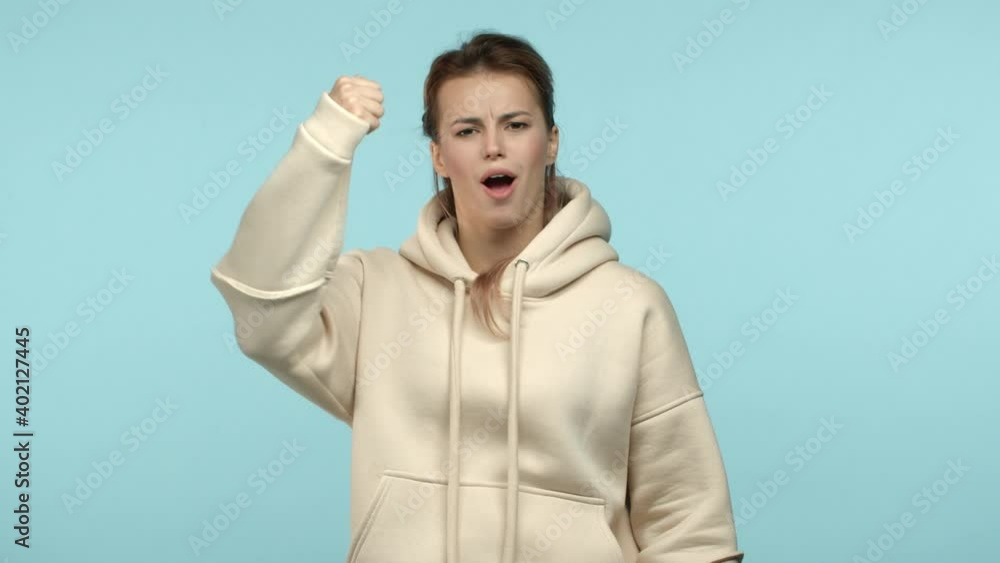 Slow motion of happy blonde girl making fist pumps and celebrating ...