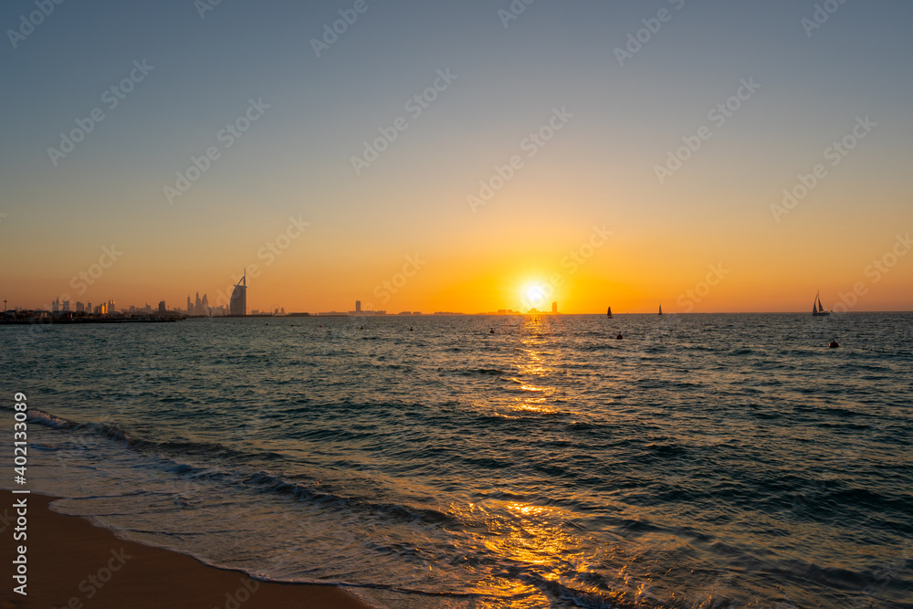 Amazing orange sunset at the beach in Dubai. Beautiful orange colors ...