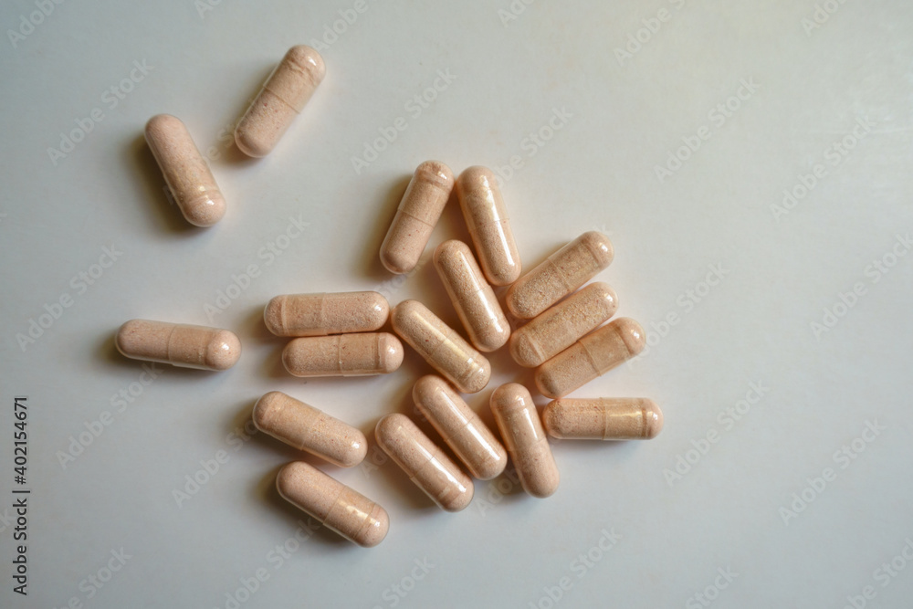 Multiple pink capsules of probiotic dietary supplement from above Stock ...