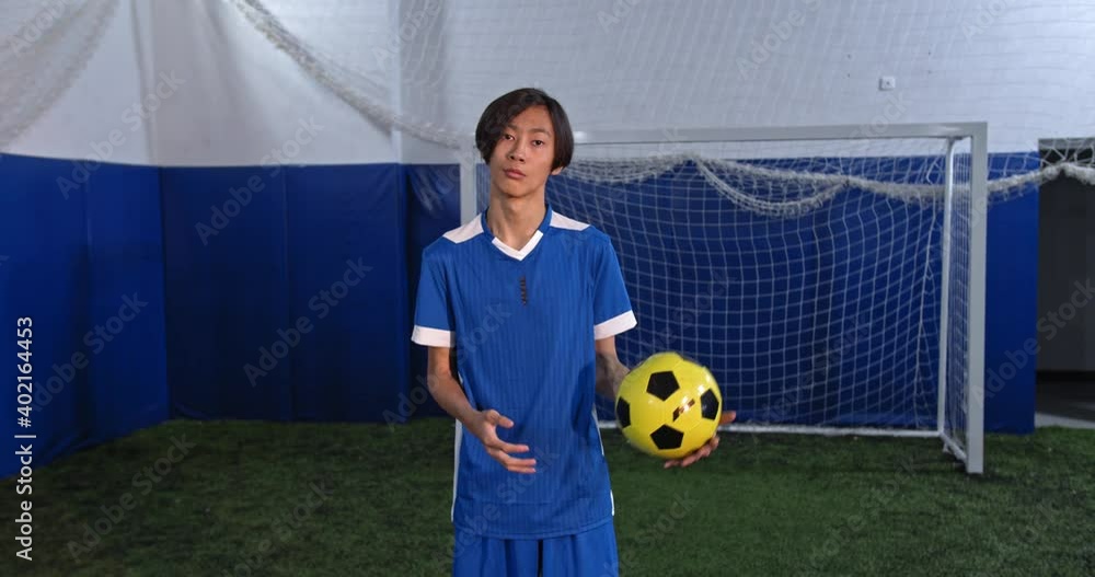 Portrait of asian professional football player, korean man after soccer ...