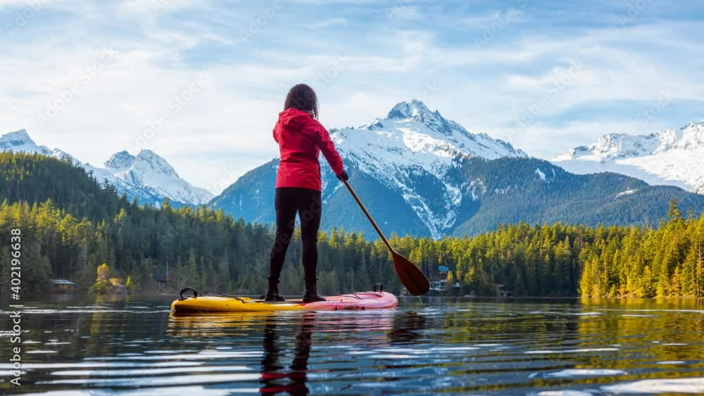 Cinemagraph Loop Animation. Adventurous Girl Paddle Boarding on Levette ...