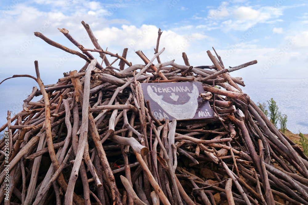 Pile of wood with a sign on the slopes of the Terevaka Volcano on ...