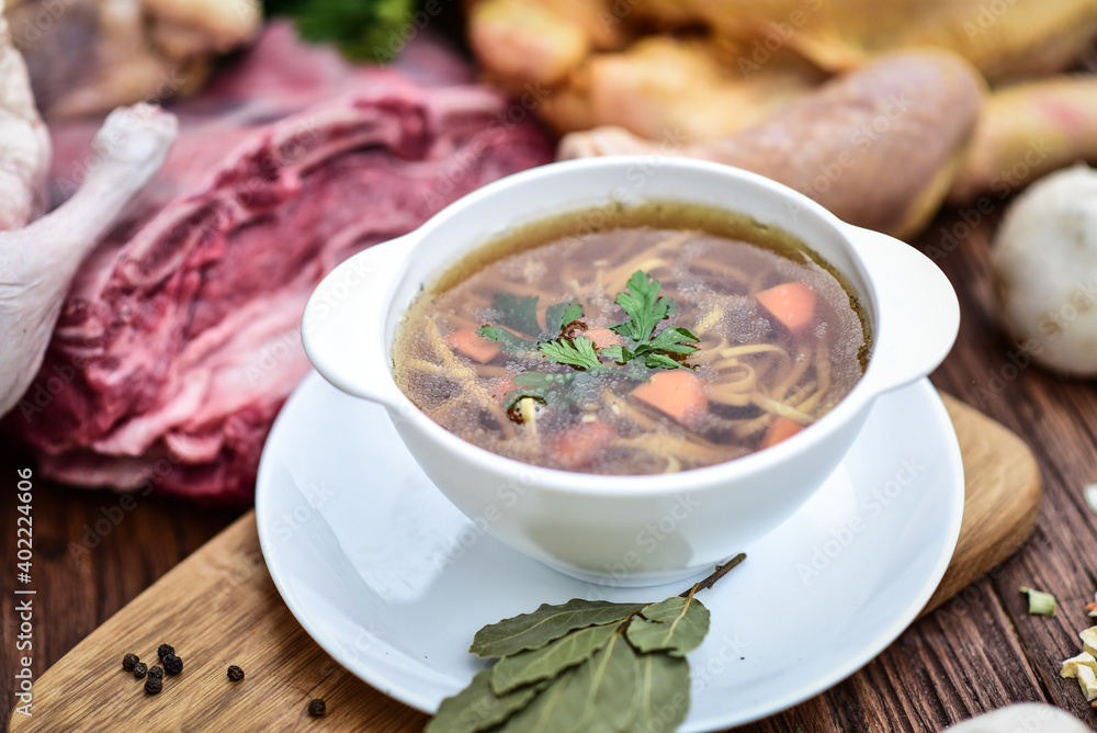 Slow-boiled broth based on several types of meat and aromatic ...