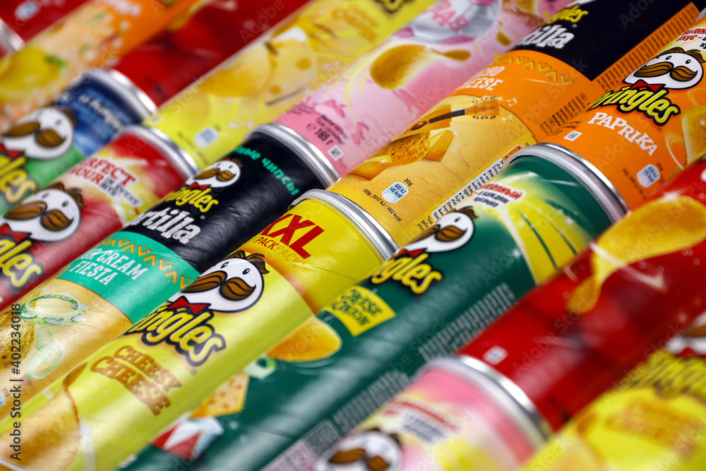 Pringles variety of flavors. Many cardboard tube cans with Pringles ...