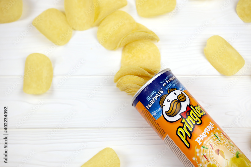 Pringles paprika flavour. Cardboard tube can with Pringles potato chips ...