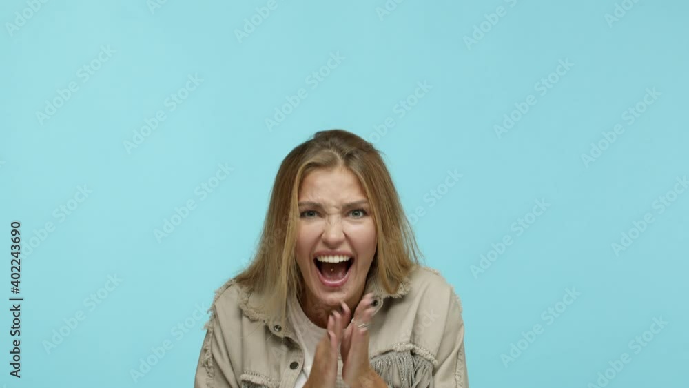 Slow motion of happy blond woman congratulate you, looking amazed and ...