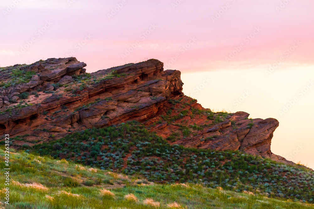 Big Bogdo mountain. Red sandstone outcrops on the slopes sacred ...
