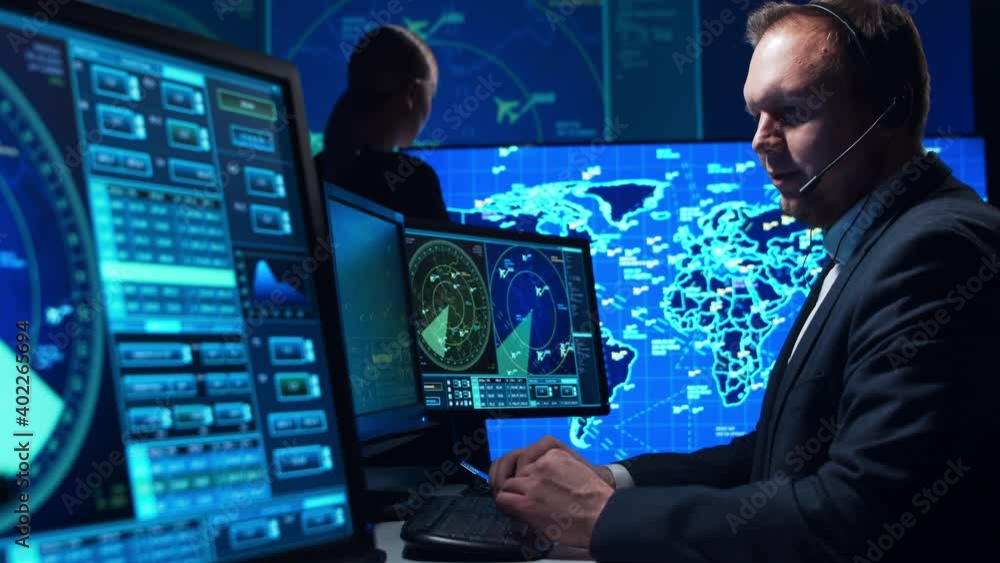 Workplace of the air traffic controllers in the control tower. Team of ...