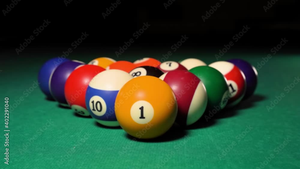 Pyramid in American billiards on black background. Ball number 1 at the ...