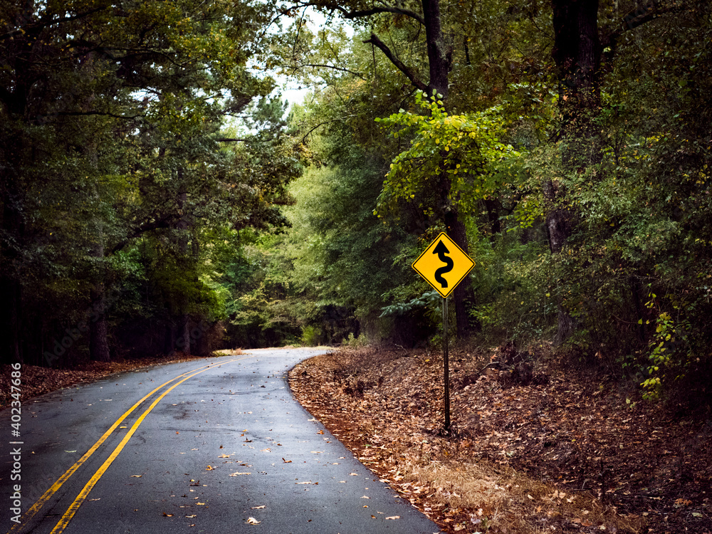 Curve in road and sign Stock Photo | Adobe Stock