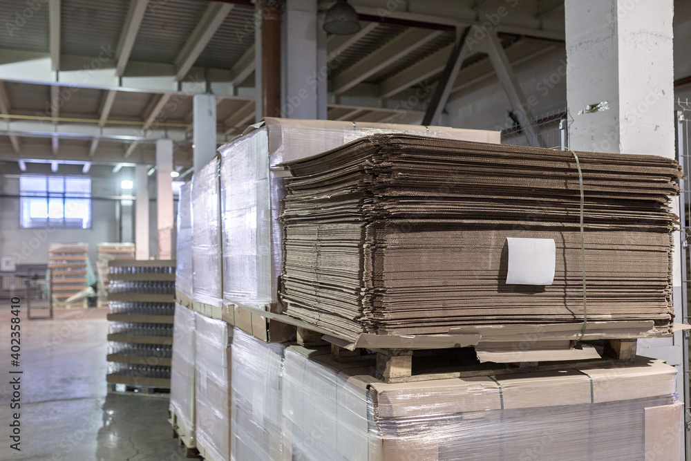 Perforated sheets of corrugated cardboard by stack on pallets - after ...