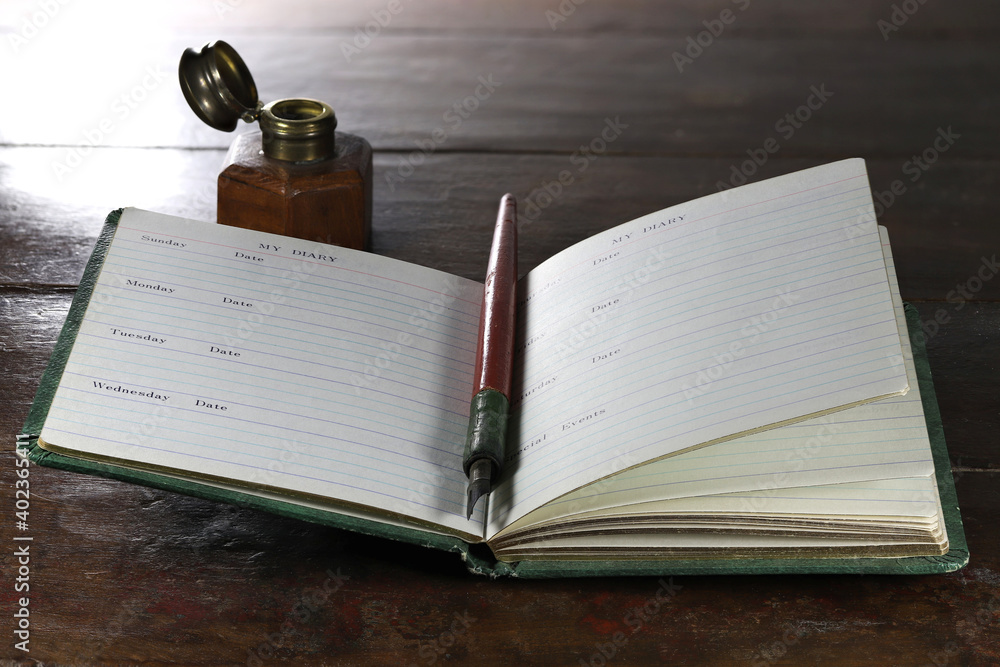 opened blank diary with dib pen and inkwell on desktop Stock Photo ...
