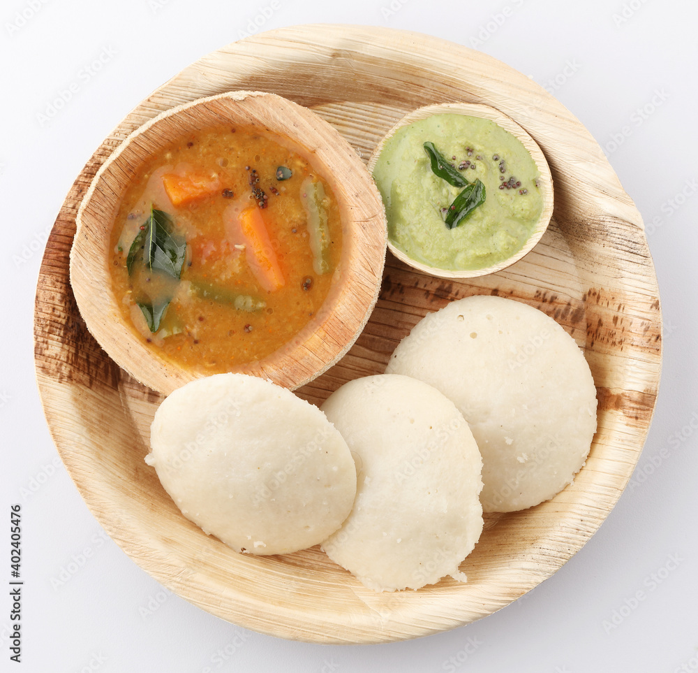 Idly sambar or Idli with Sambhar and green, red chutney. Popular South ...