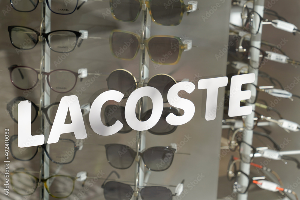 lacoste sign text and logo store of optic fashion clothes brand in ...