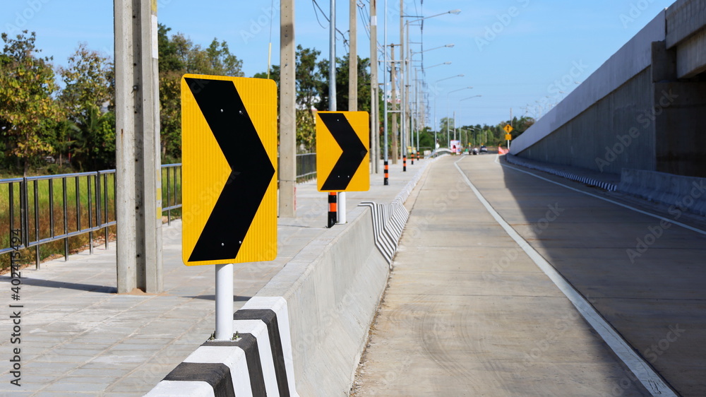 Chevron Signs. Warning signs that guide the curves of the U-turn under ...