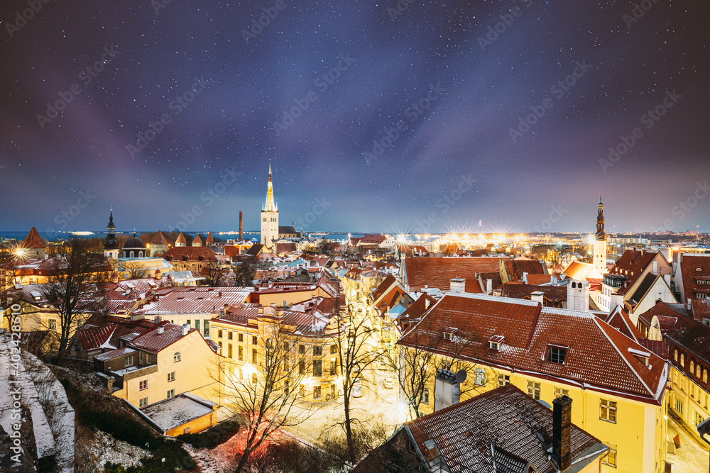 Tallinn, Estonia. Night Starry Sky Above Traditional Old Architecture ...