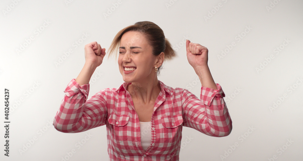 A young stressed blonde hair woman shouting isolated on white ...