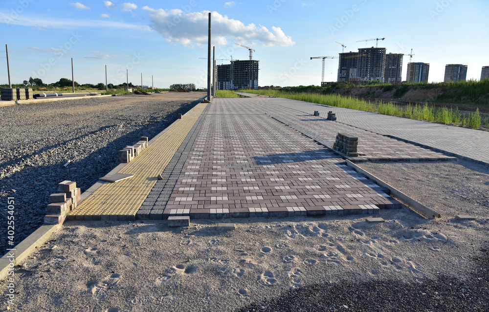 Process of installing paving bricks at construction site. Laying paving ...
