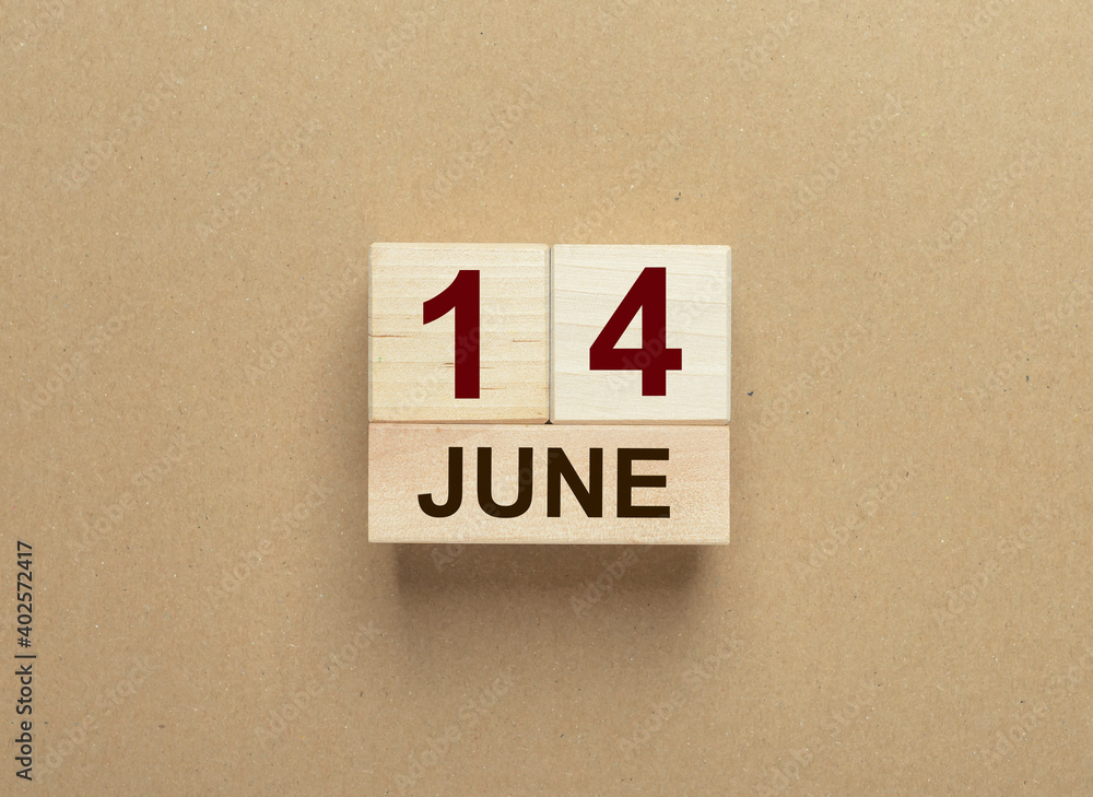 14 June inscription on wooden cube calendar. Donor day or flag day ...