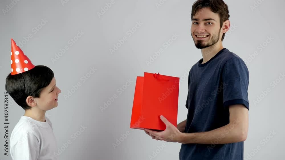 Boy gives a gift with a cap. Birthday. post messages or various ...