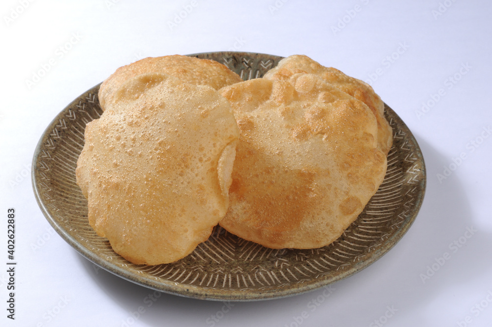 puri or poori fried Indian bread made from wheat Stock Photo | Adobe Stock