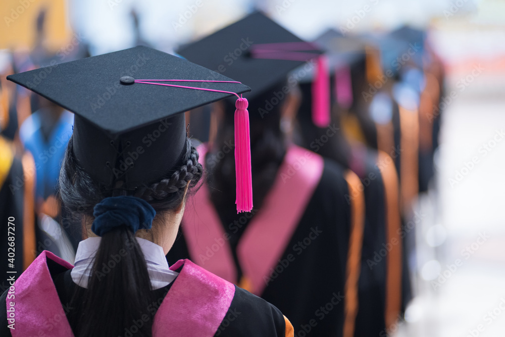 Rearview of the university graduates line up for degree award in ...