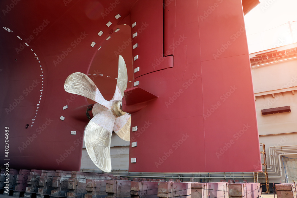 Close up Big Propeller and rudder at stern of big ship during ...