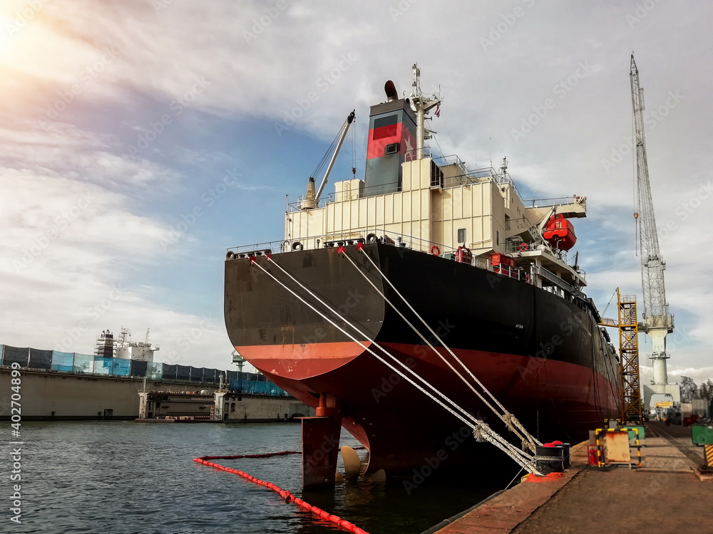 Cargo ship alongside in the sea, Stern ship with rudder and propeller ...