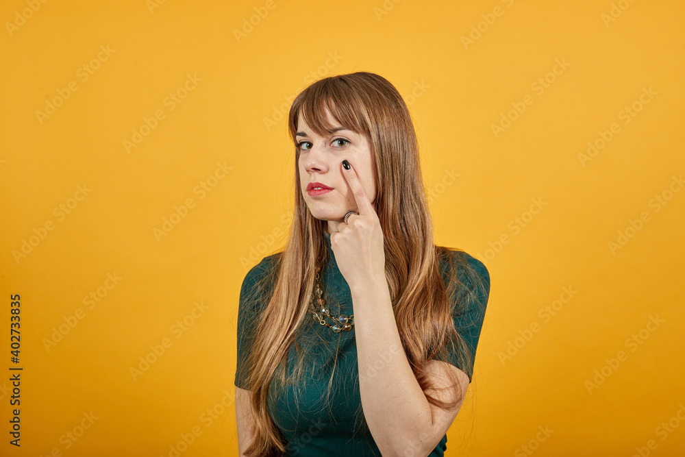 Contact lens on index finger, pointing eye with hand, thinking, having ...
