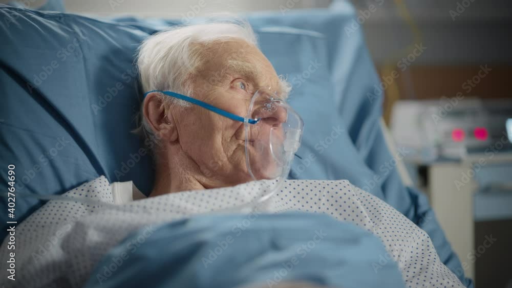Hospital Ward: Portrait of Elderly Man Wearing Oxygen Mask Resting in ...