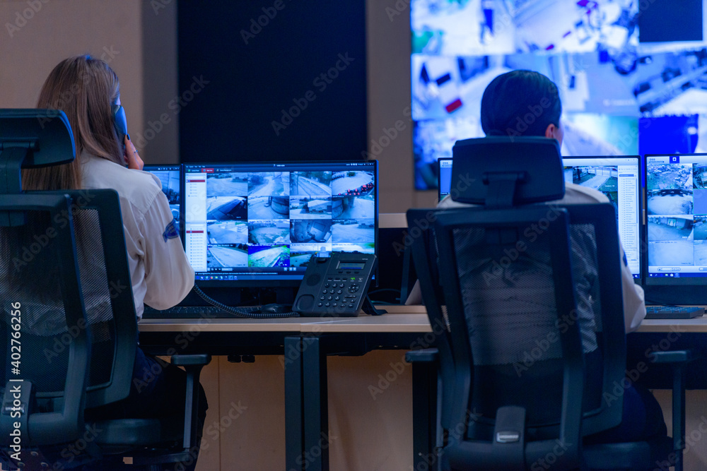 In the System Control Room, Technical Operator Works at His Workstation ...