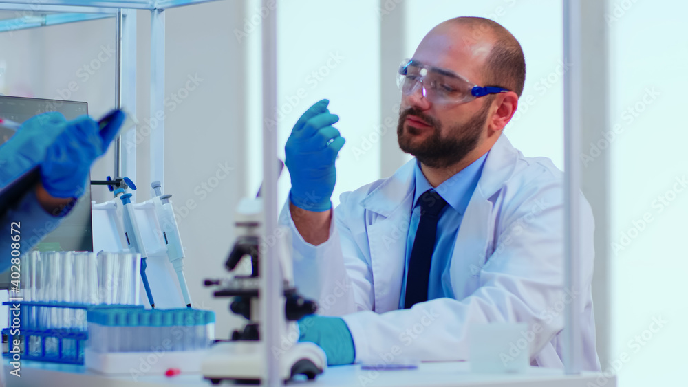 Doctor dictating to nurse virus results informations looking on test ...