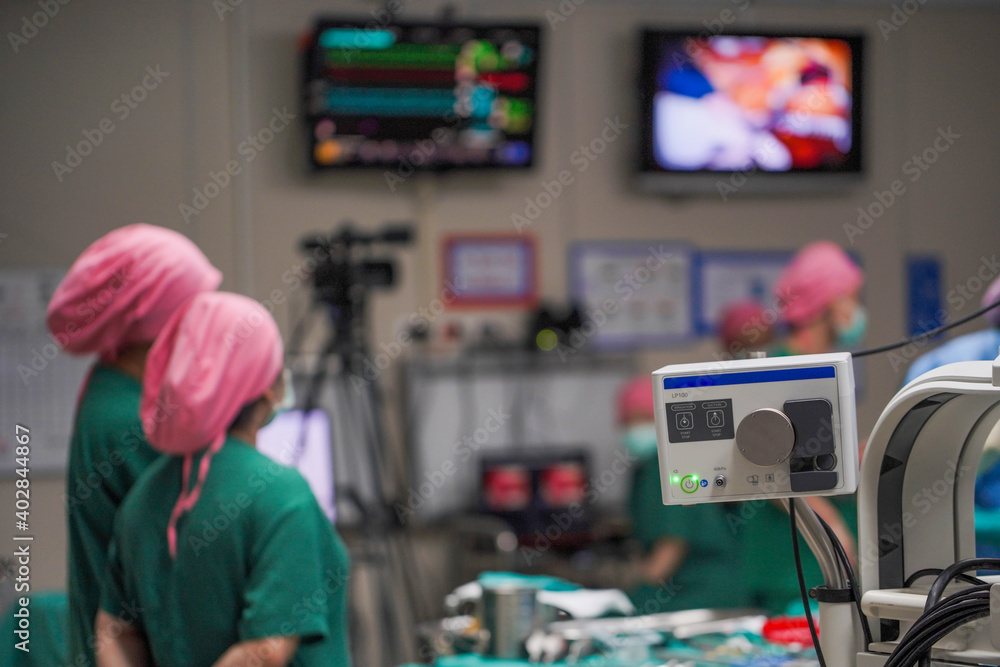 Vital signs monitor with machines during surgery on a patient in ...