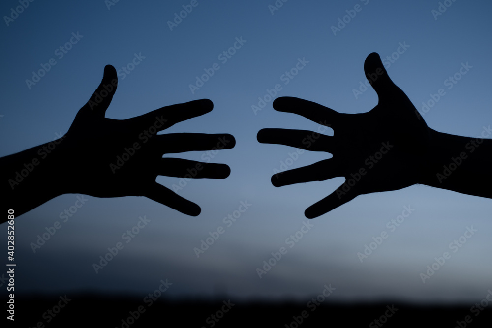 Helping hand. Care and support concept. Silhouette. Two hands. Two ...