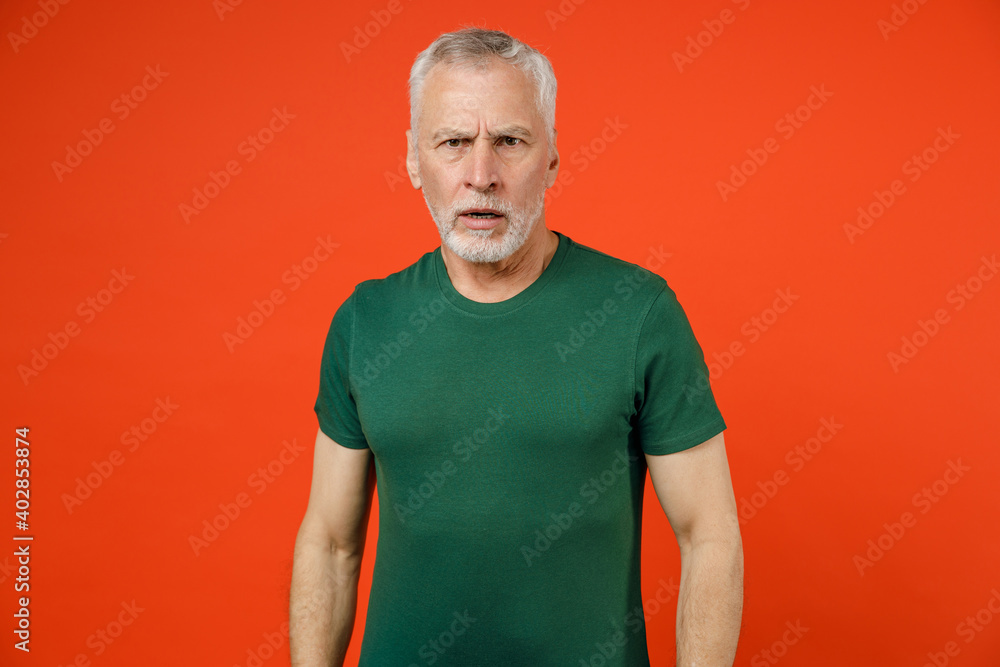 Shocked perplexed worried elderly gray-haired mustache bearded man ...