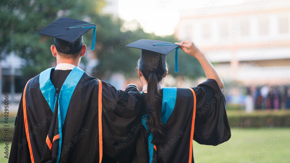 Rear view of the university graduates line up for degree award in ...