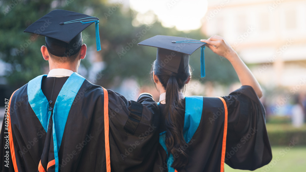 Rear view of the university graduates line up for degree award in ...